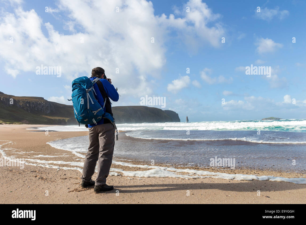 Walker Photographing the Sea Stack of Am Buachaille, Sandwood Bay ...