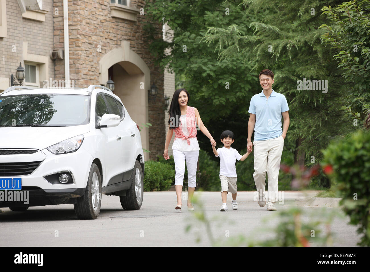 Boy with his parents Stock Photo - Alamy