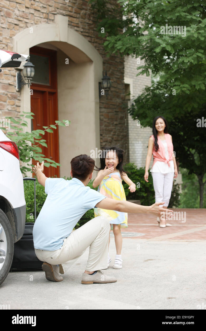 Girl with parents Stock Photo - Alamy