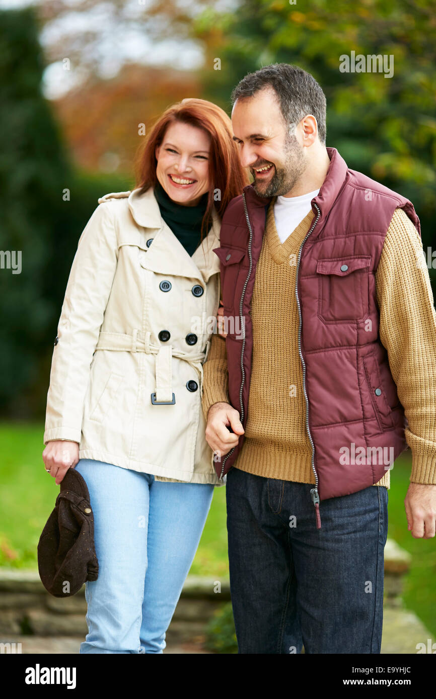 Happy couple walking together Stock Photo - Alamy