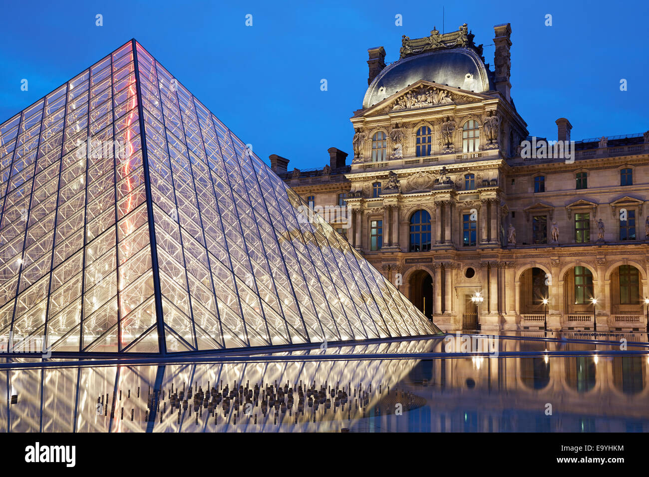 Louvre museum and pyramid night view Stock Photo - Alamy