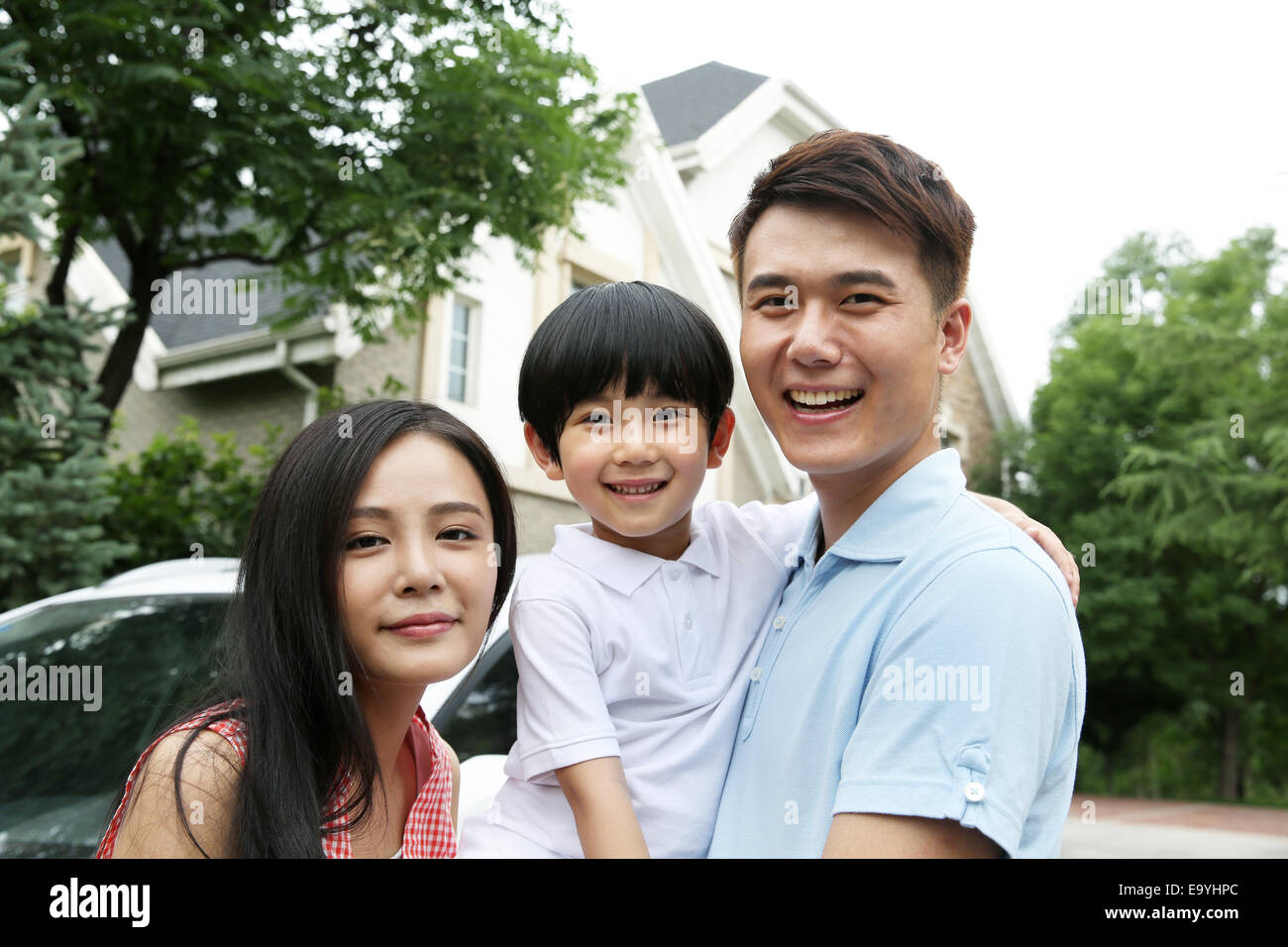 Boy with his parents Stock Photo - Alamy