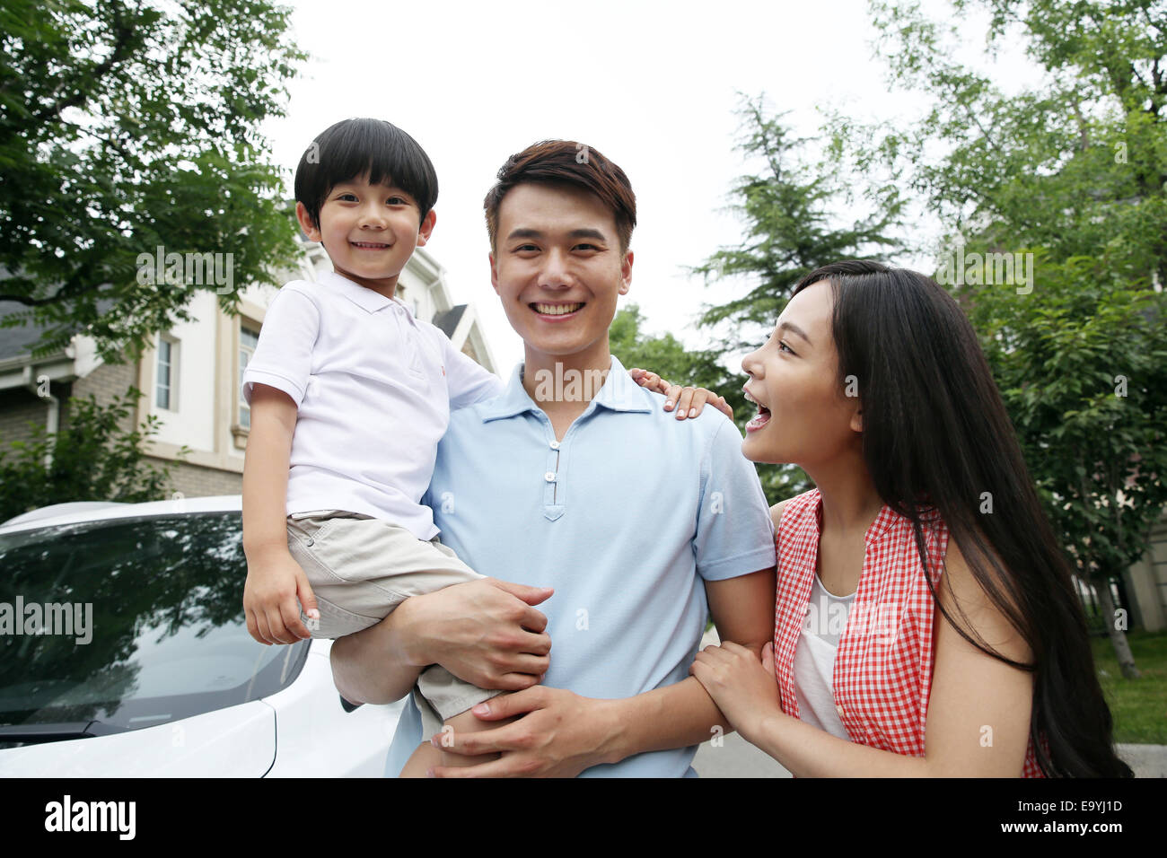 Boy with his parents Stock Photo - Alamy