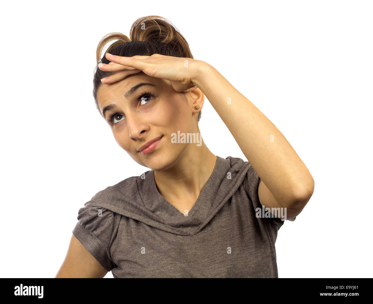 Close up of a beautiful woman looking up with a hand in forehead with a ...