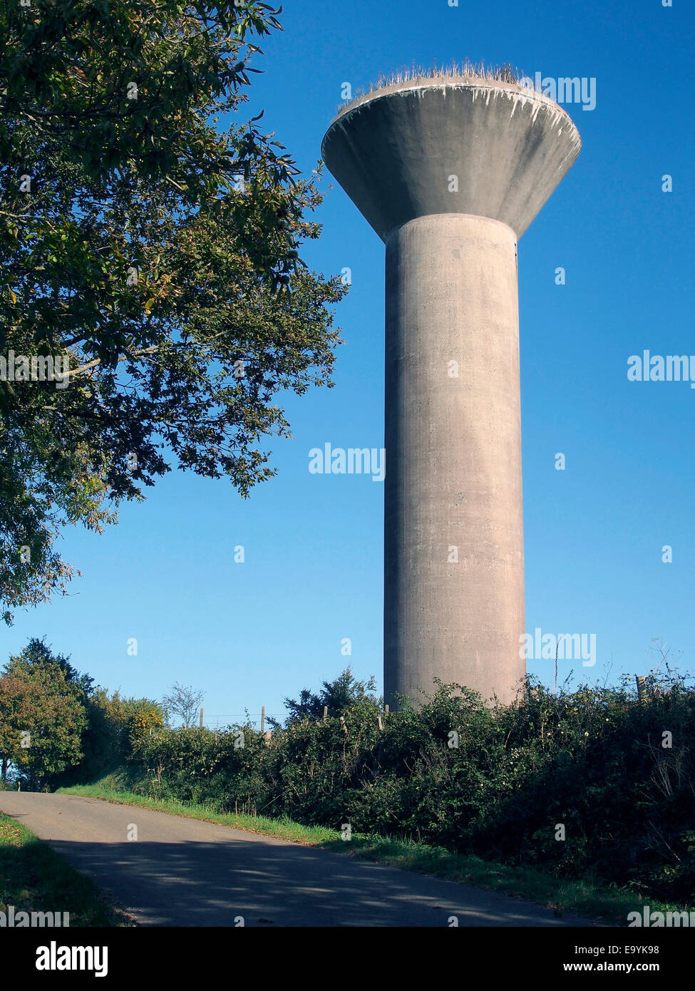 A typical French concrete water tower in rural southern Normandy near ...
