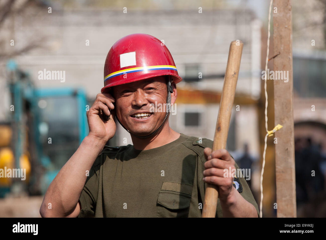 A construction worker call Stock Photo - Alamy