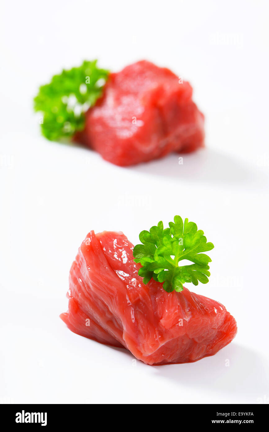 Raw beef cut into cubes Stock Photo - Alamy