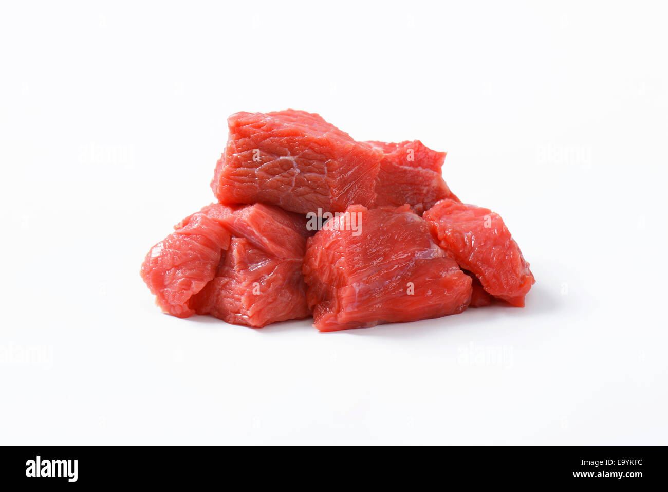 Raw beef cut into cubes Stock Photo - Alamy