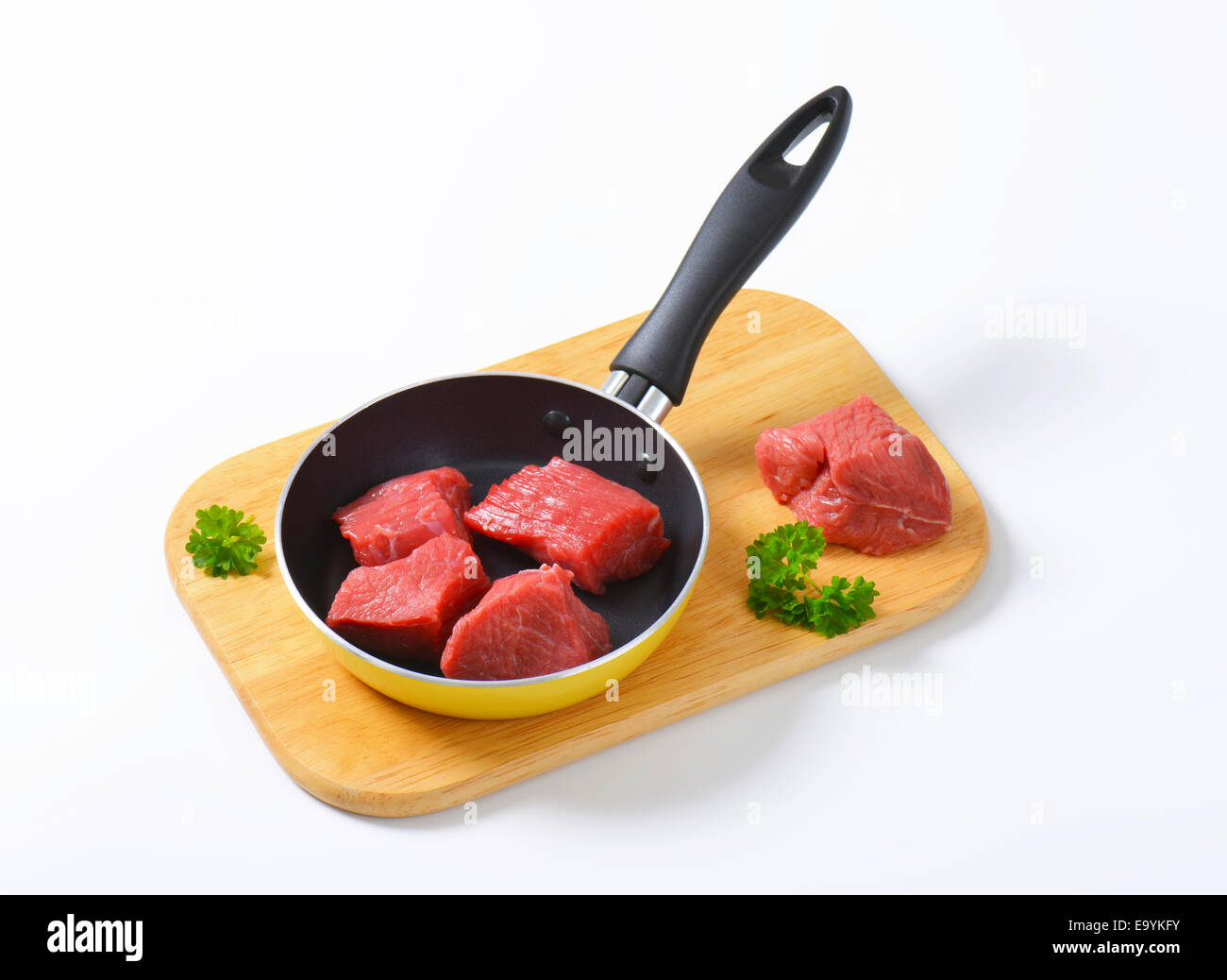 Raw meat in frying Cut Out Stock Images & Pictures - Alamy