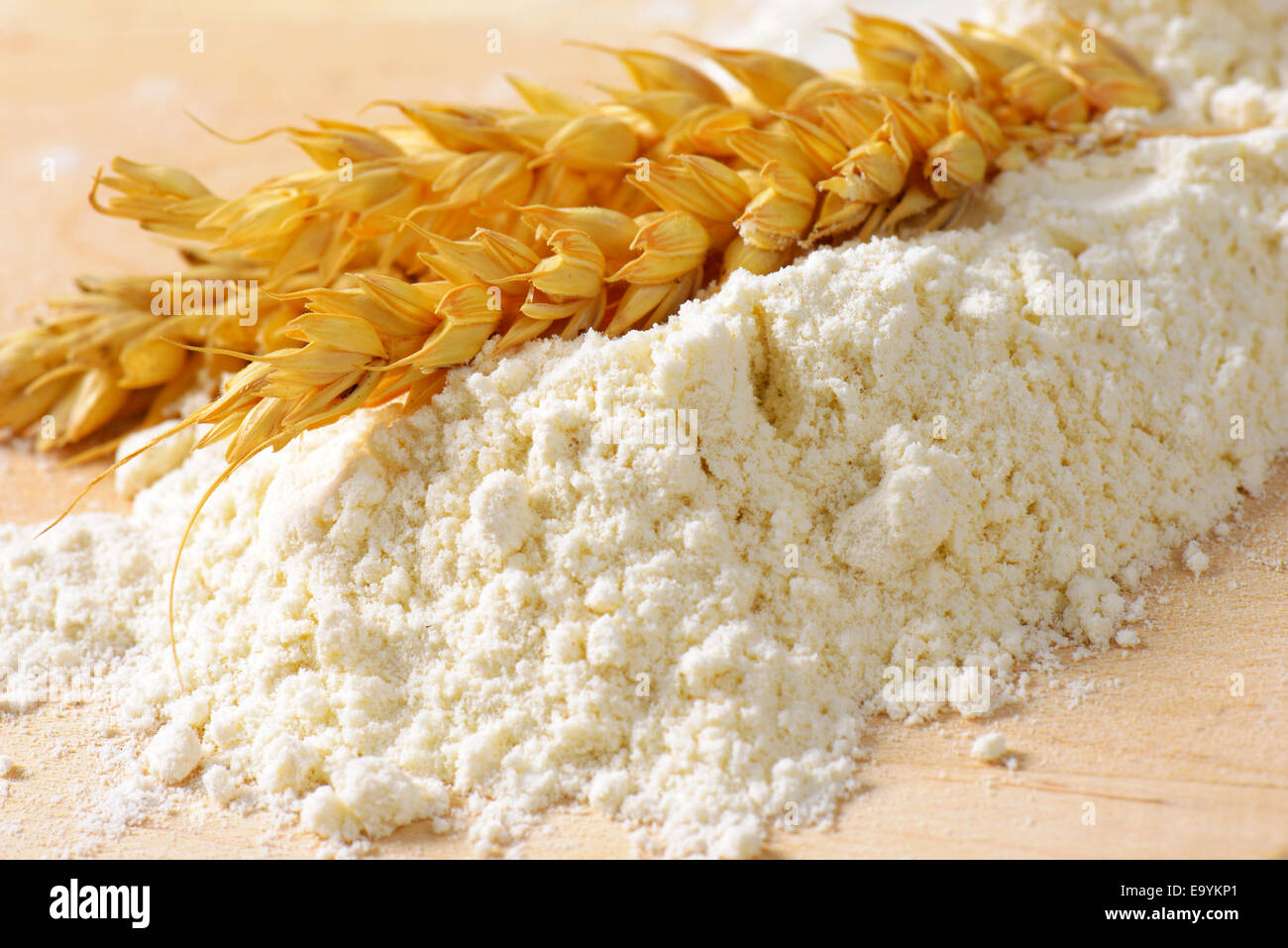 Wheat ears on pile of soft flour Stock Photo - Alamy