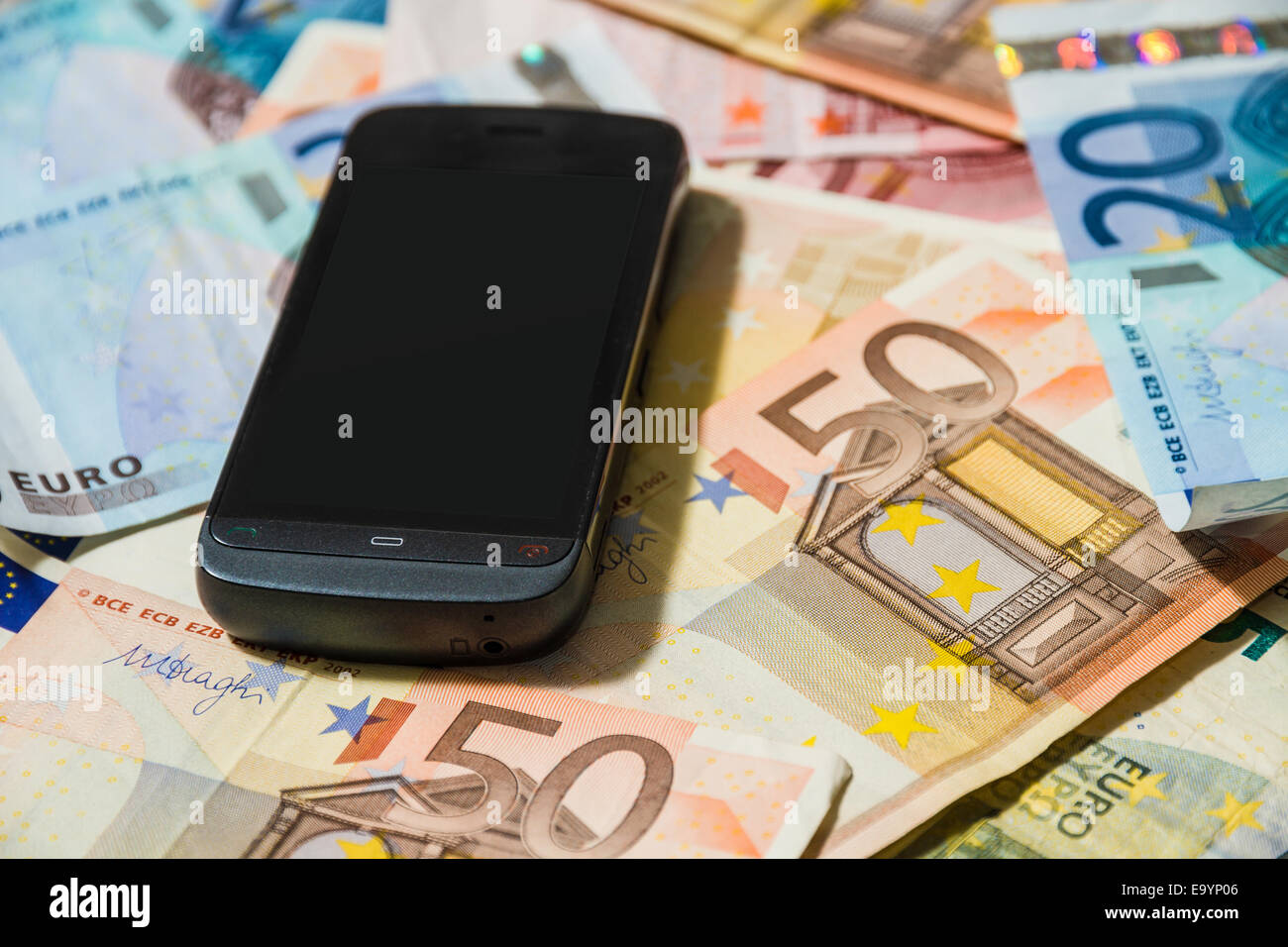 Phone and money, mobile banking and payments Stock Photo - Alamy