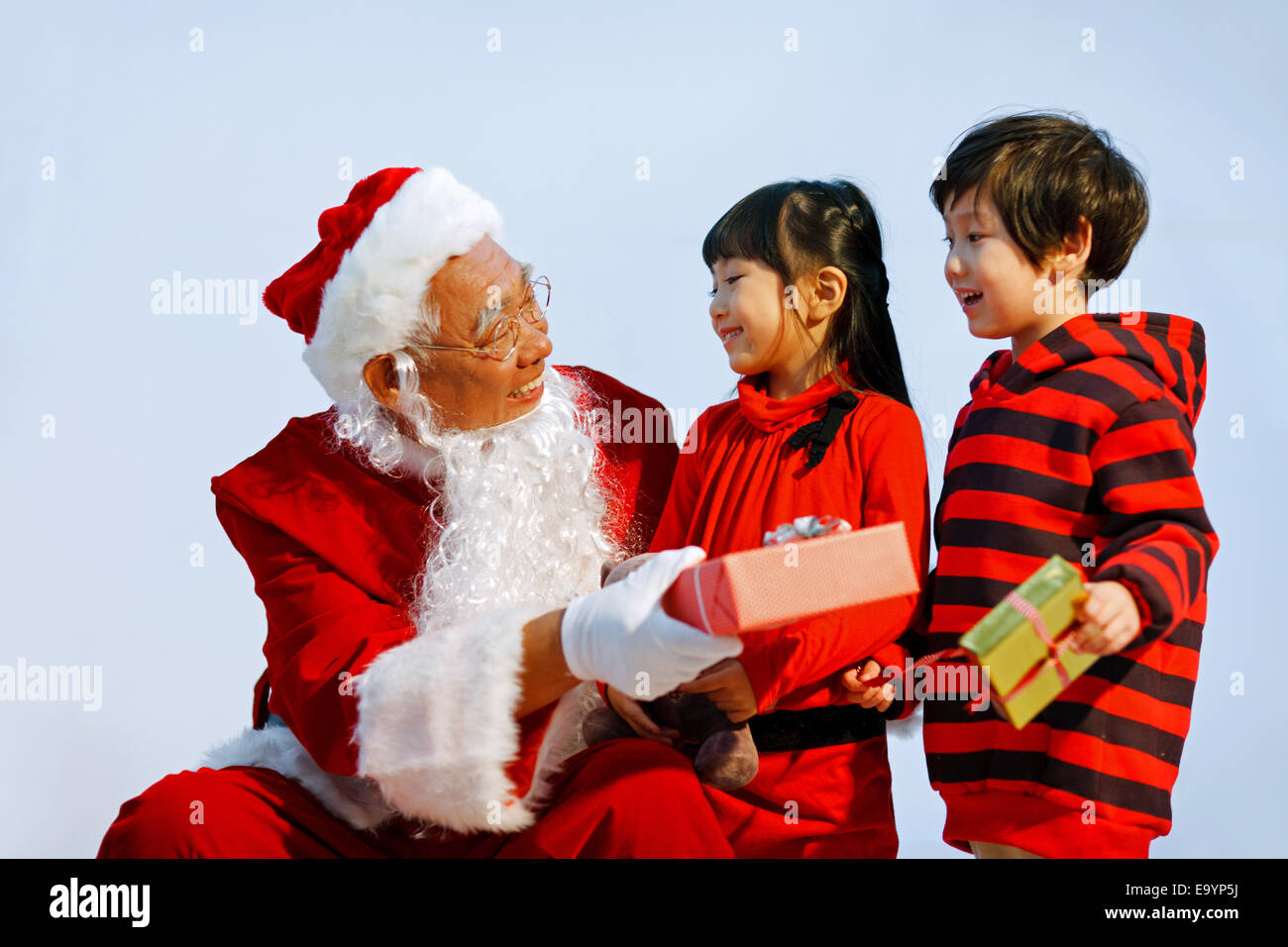 Santa Claus with children Stock Photo - Alamy