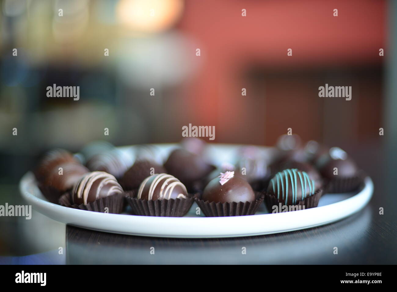 A plate with chocolate candies Stock Photo - Alamy
