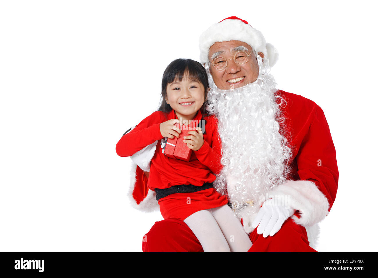 Girl sitting on santa claus hi-res stock photography and images - Alamy