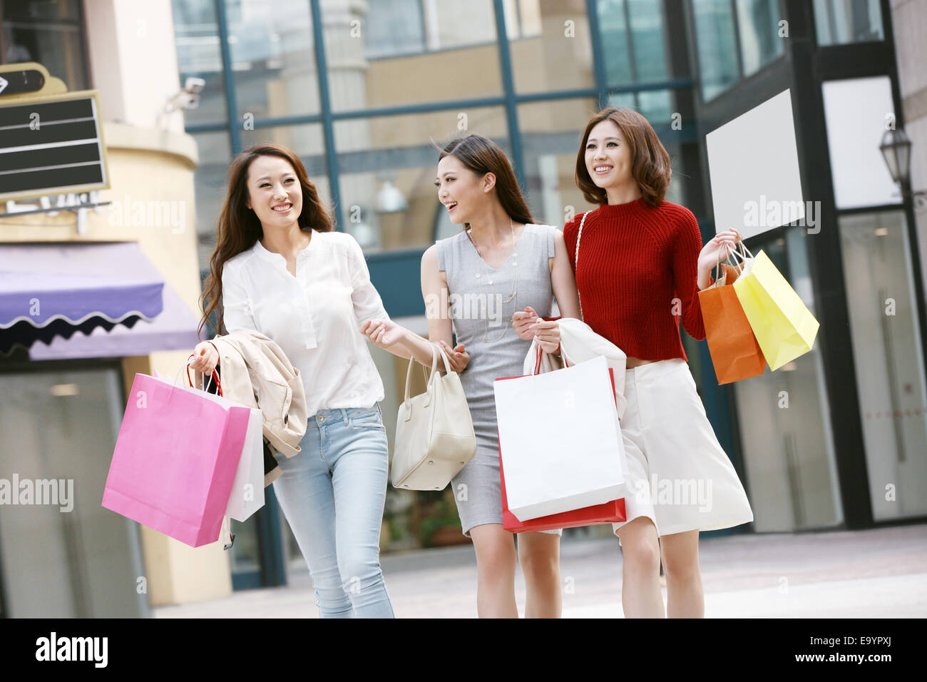 Young women shopping Stock Photo - Alamy