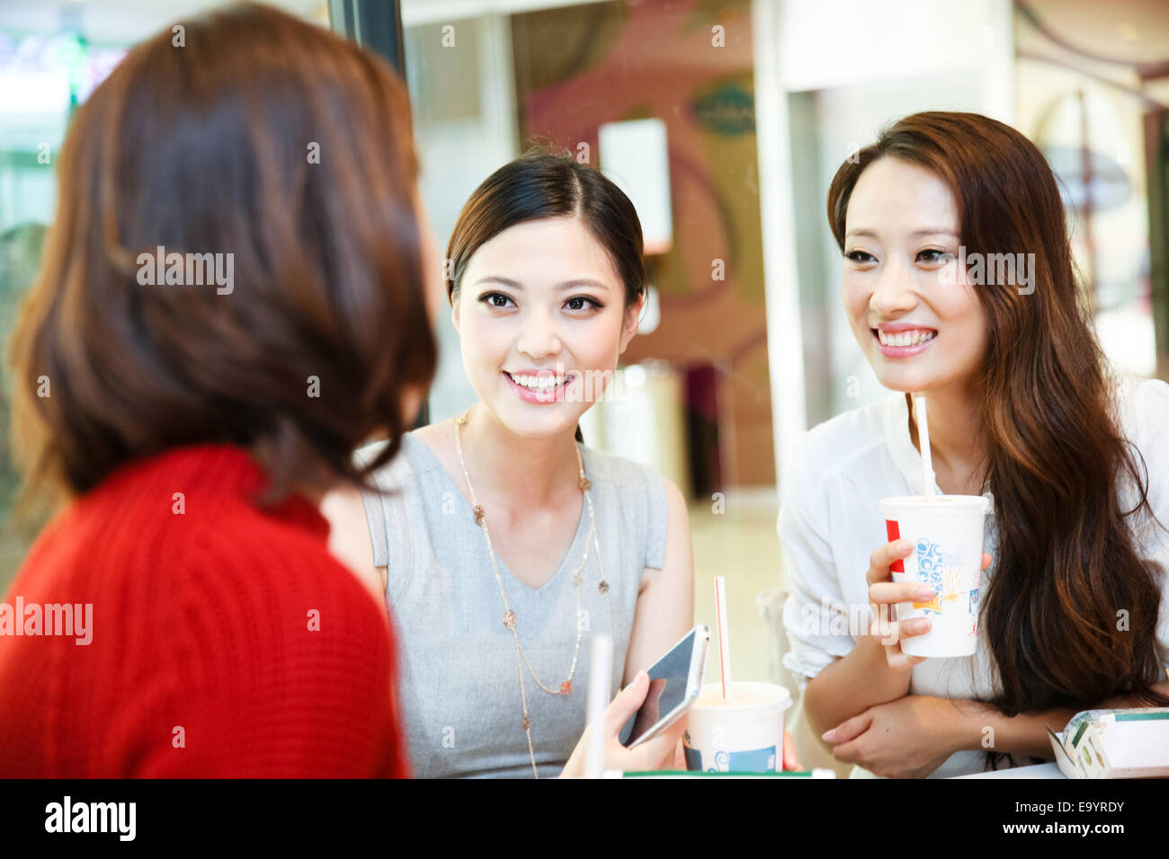 Young women in cafe Stock Photo - Alamy