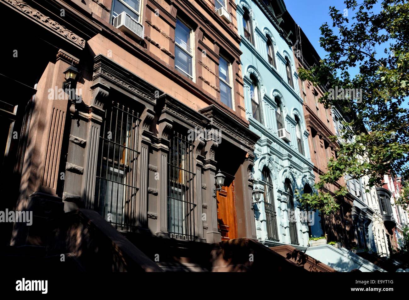 NYC: Classic late 19th century brownstones with stoops and stairs line ...