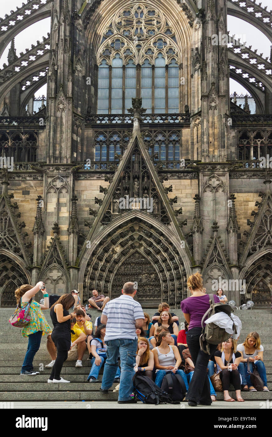 Tourists on the steps of the Roman Catholic Cathedral, the country's ...