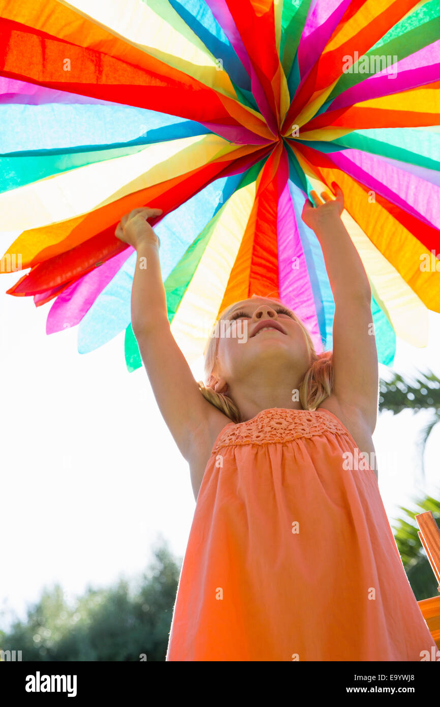 Girl putting up decoration Stock Photo - Alamy