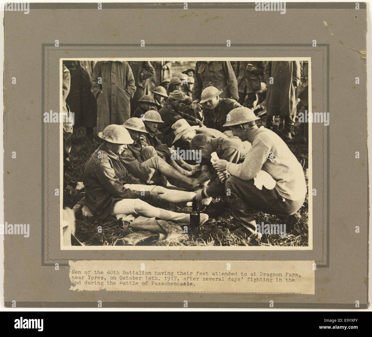 Soldiers from the 40th Battalion, AIF, receive medical attention for ...