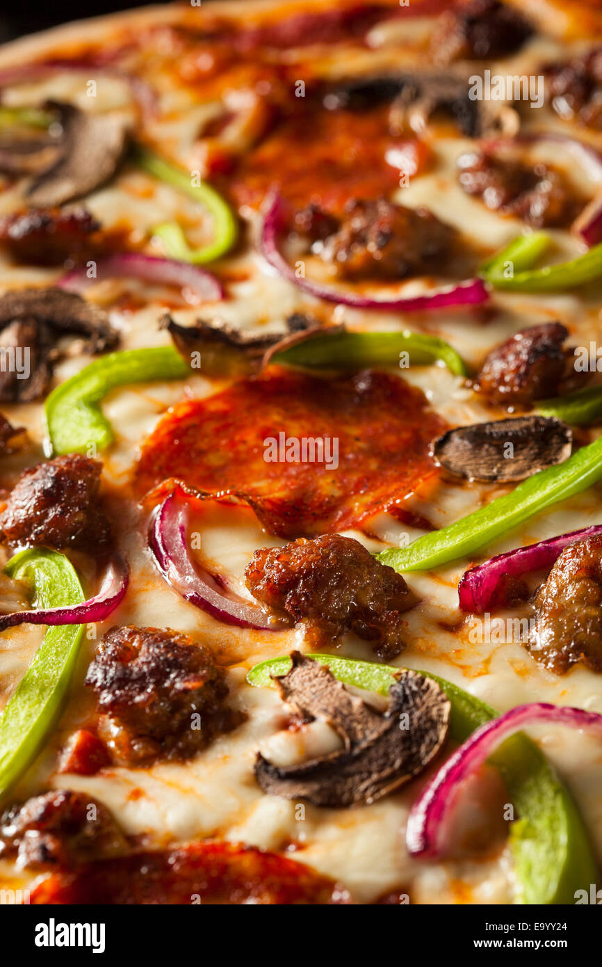 Homemade Hot Supreme PIzza with Pepperoni Peppers and Sausage Stock ...