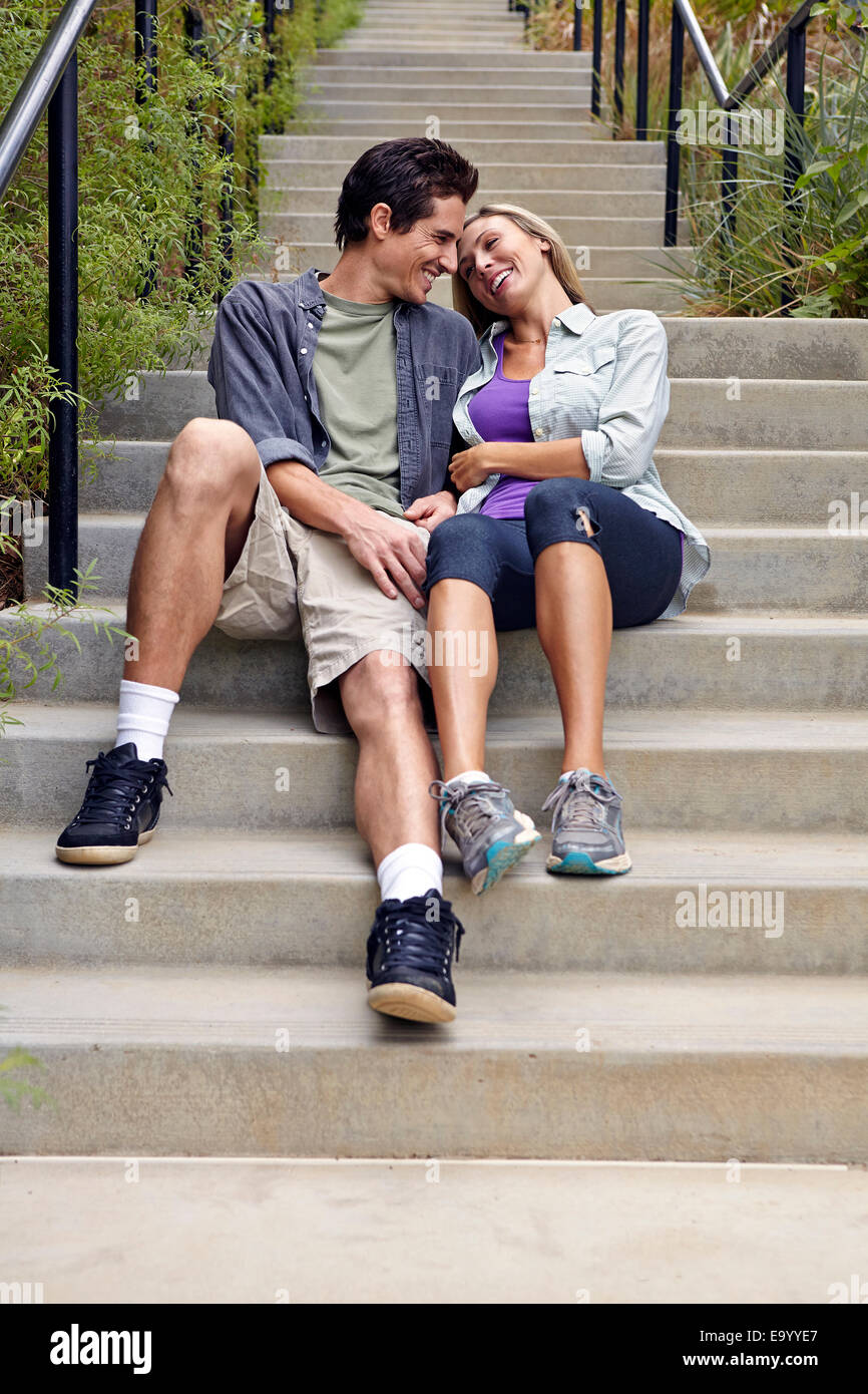 Couple hugging on steps Stock Photo - Alamy