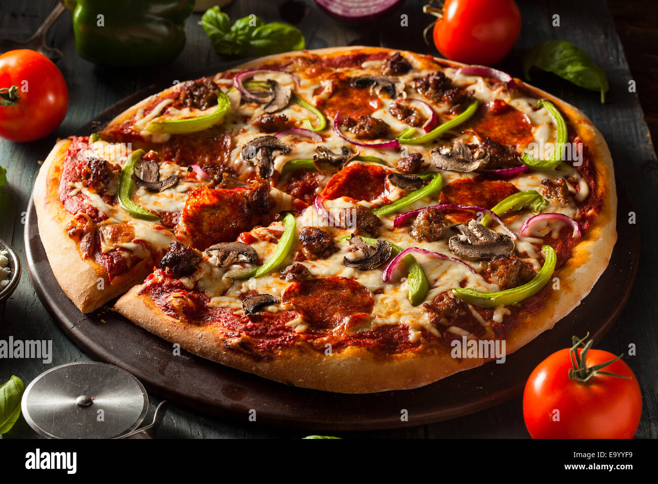 Homemade Hot Supreme PIzza with Pepperoni Peppers and Sausage Stock ...