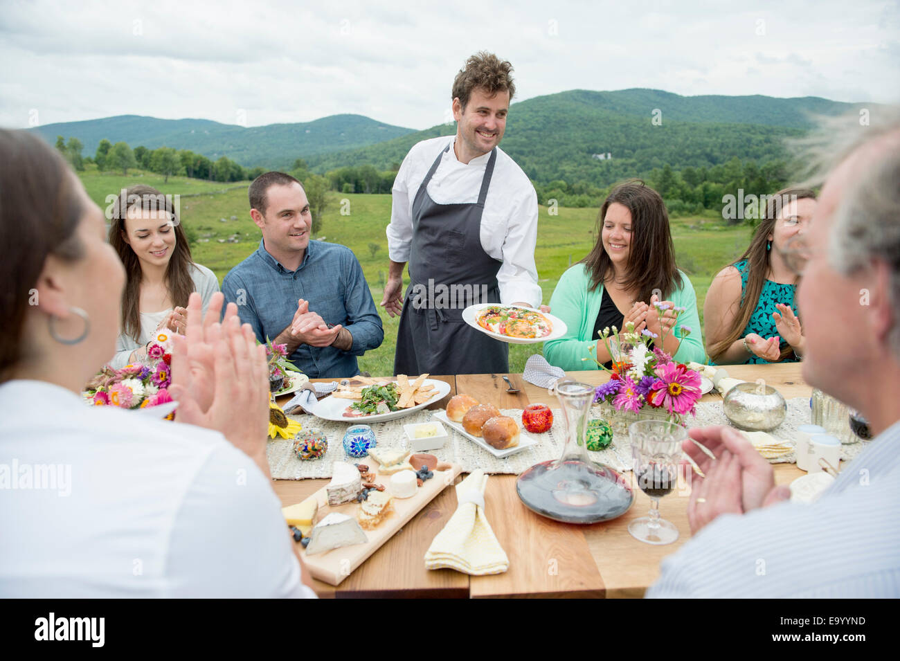Family members sitting at table hi-res stock photography and images - Alamy