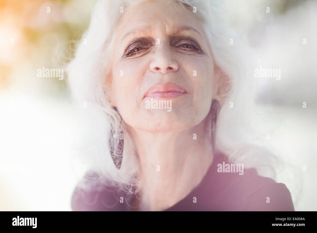 Gray haired woman smiling with confidence Stock Photo - Alamy