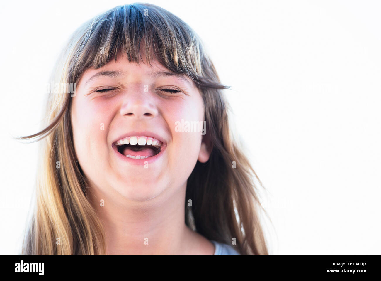 Close up portrait of girl laughing with eyes closed Stock Photo - Alamy