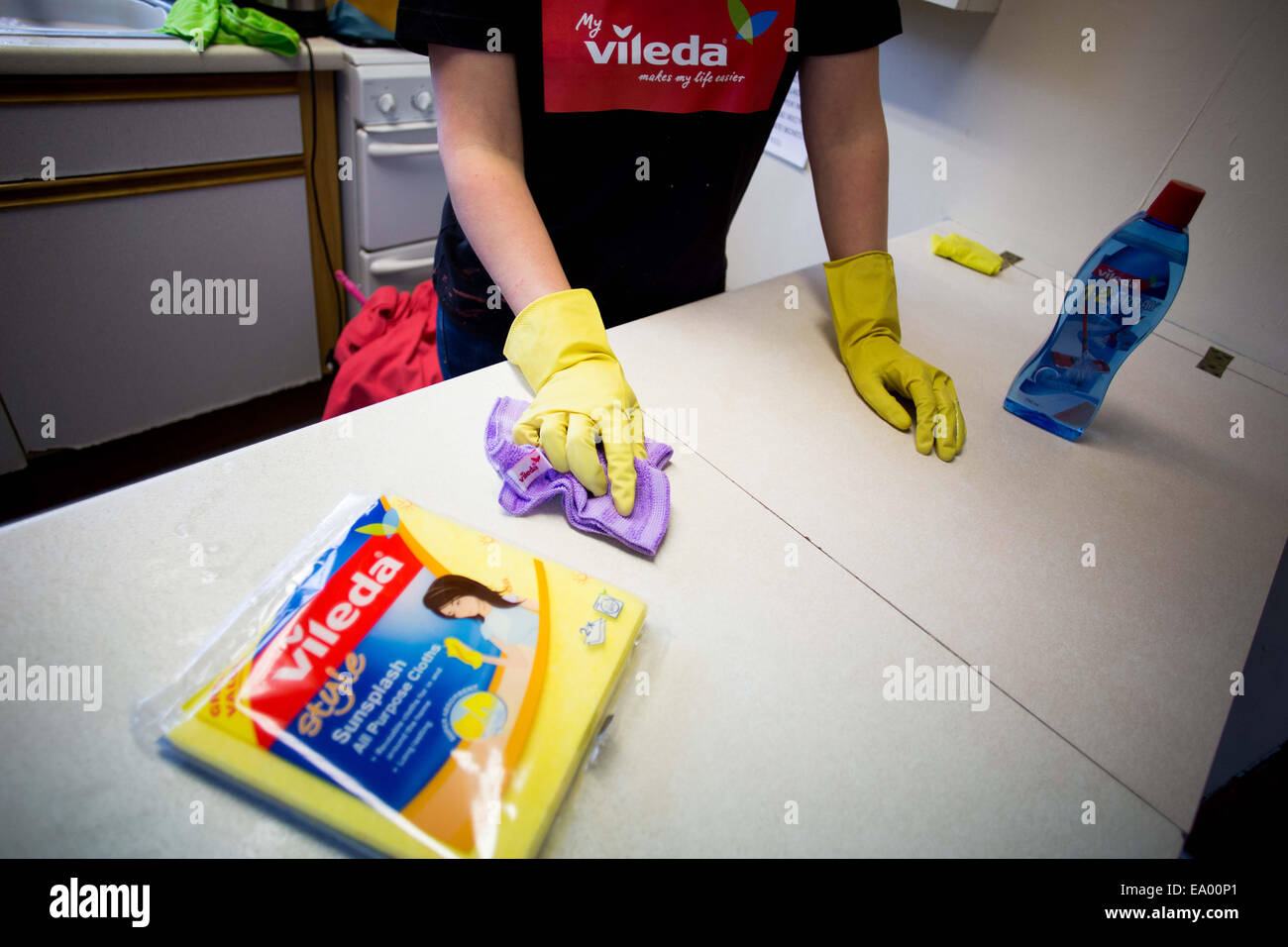a woman cleans a kitchen using Vileda cleaning products Stock Photo - Alamy