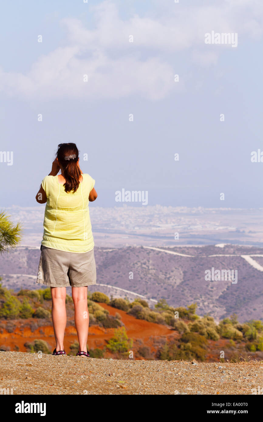 Woman tourist takes in the veiw overlooking Larnaca from Stavrovouni ...