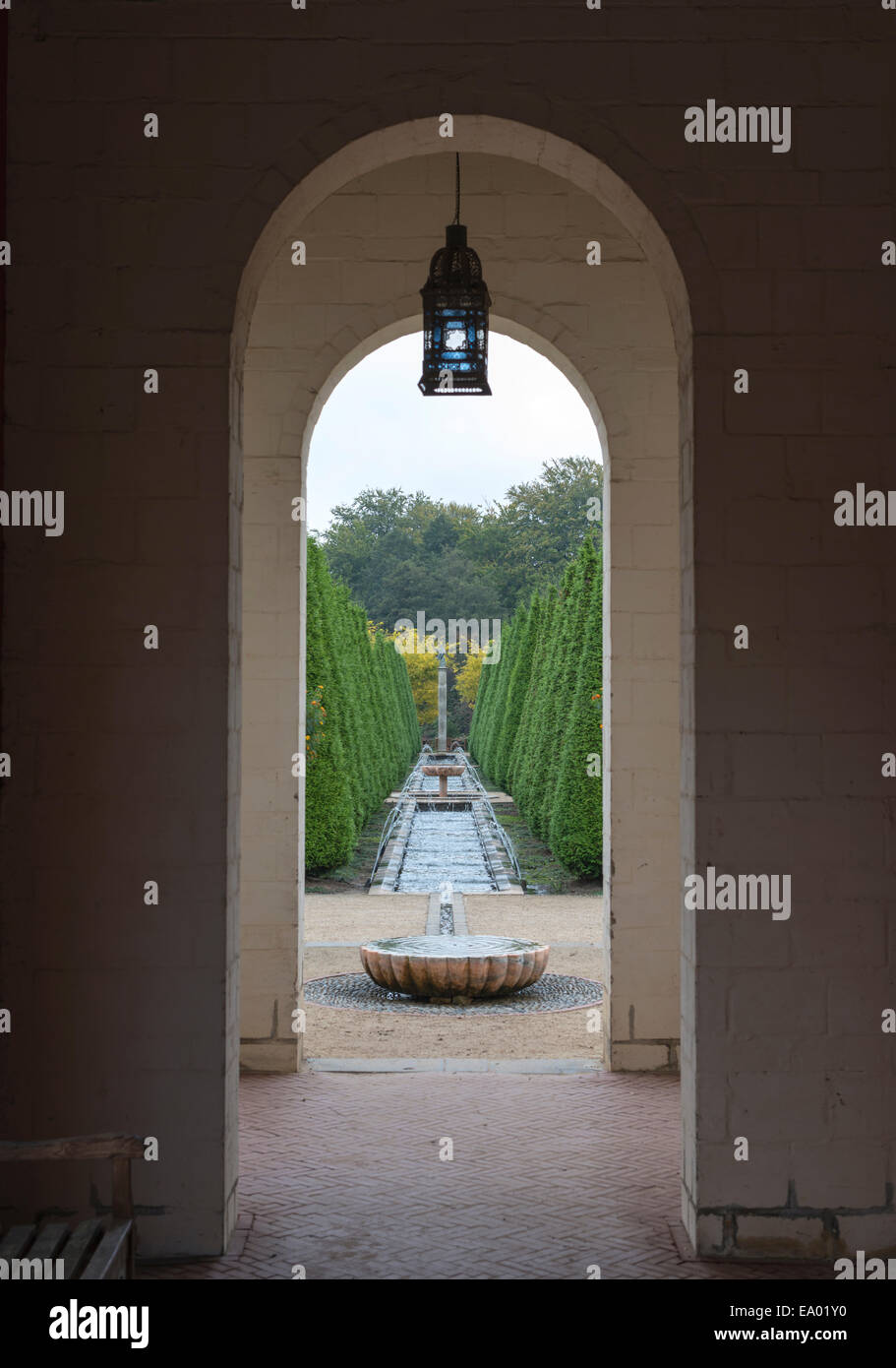 view through bow of stone in english garden Stock Photo - Alamy