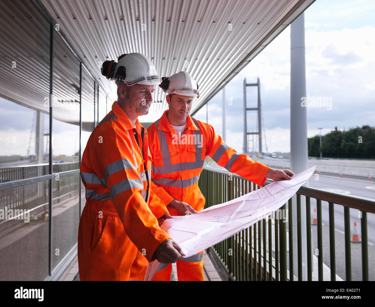 Engineer looking at bridge and plans hi-res stock photography and ...