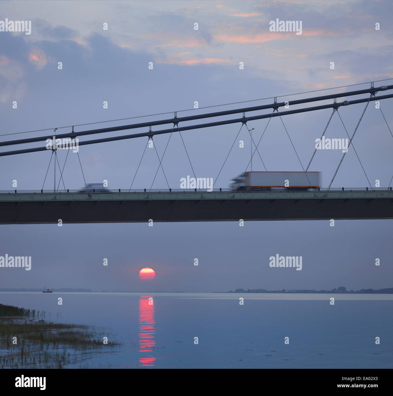 Bridge over water at sunset hi-res stock photography and images - Alamy