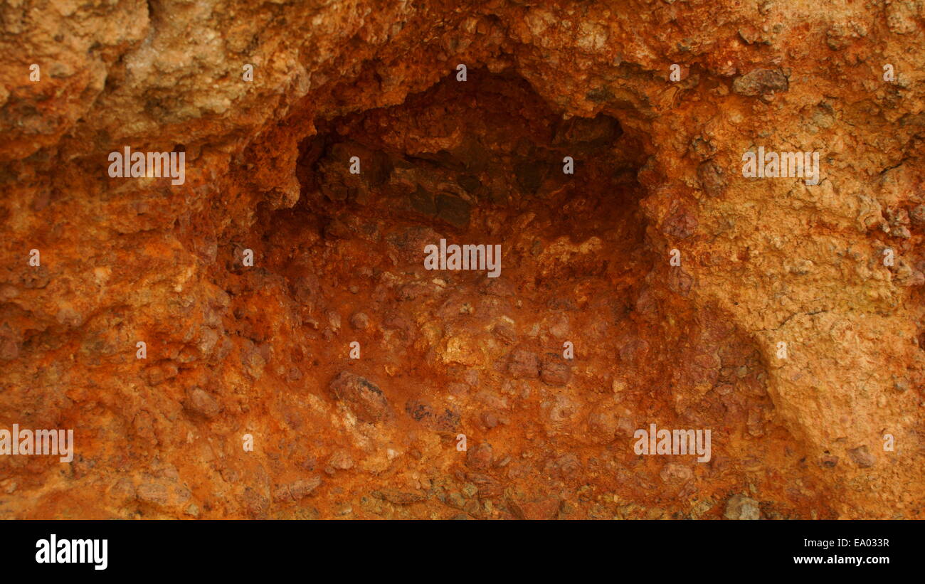 Red rocks, mineral deposits, Ibiza Stock Photo - Alamy