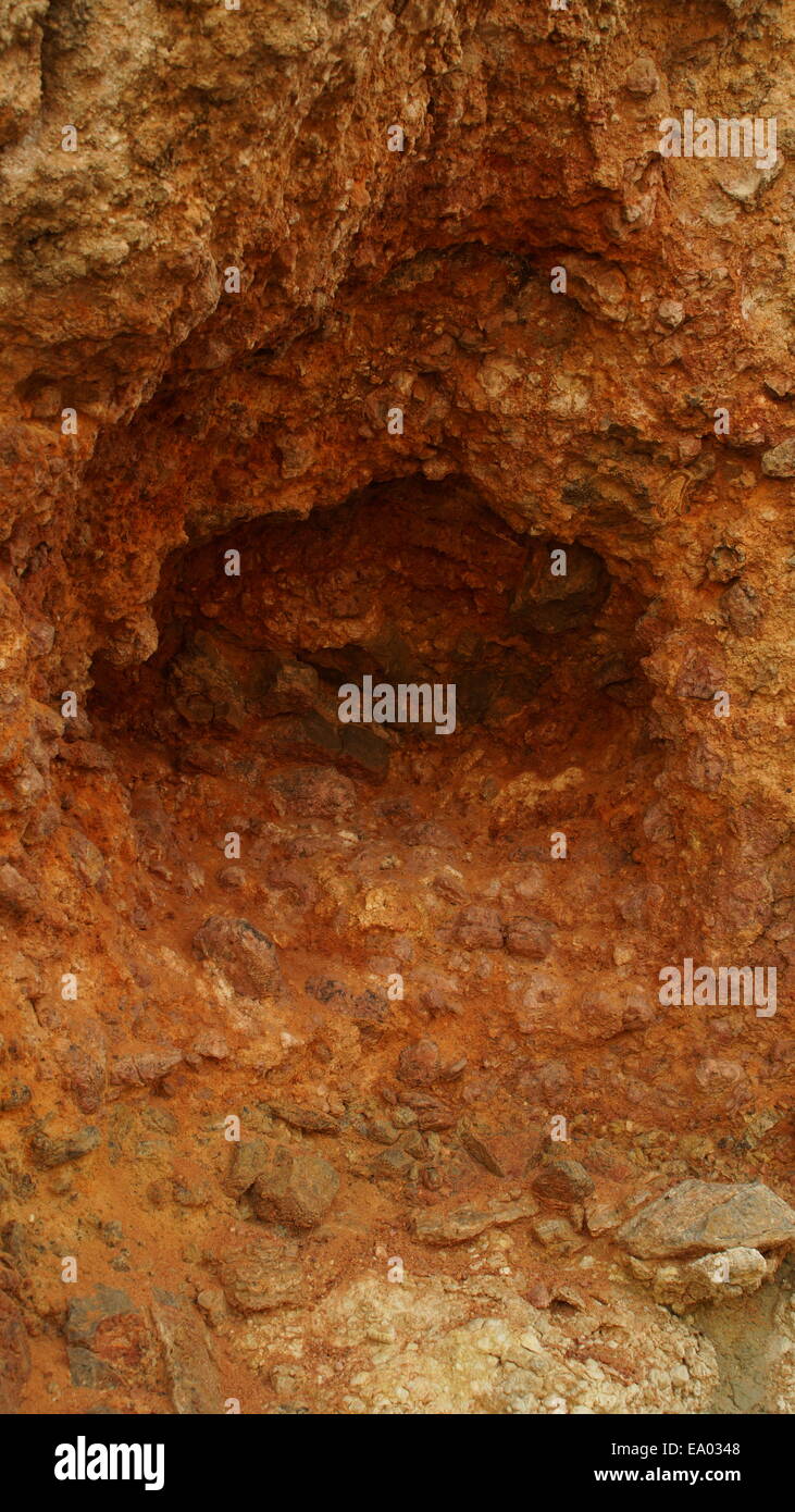 Red rocks, mineral deposits, Ibiza Stock Photo - Alamy