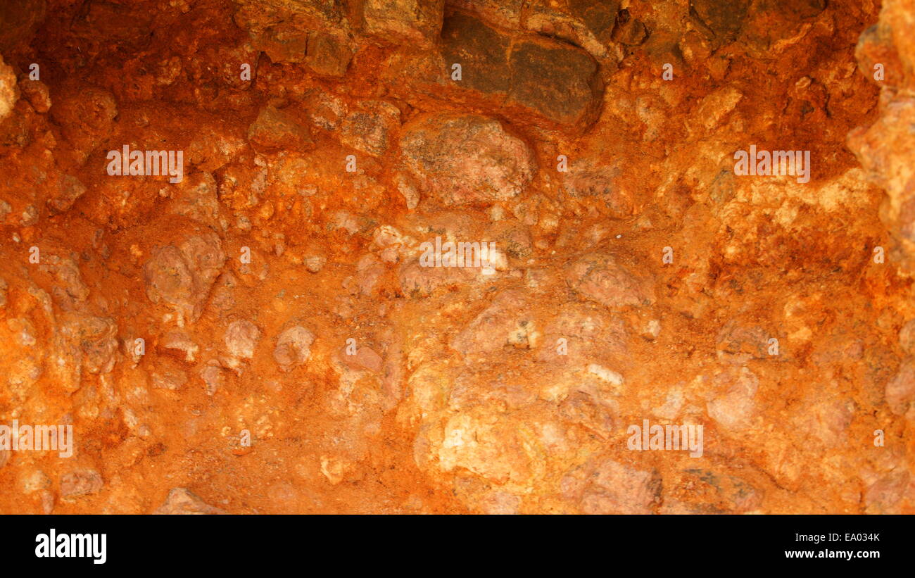Red rocks, mineral deposits, Ibiza Stock Photo - Alamy