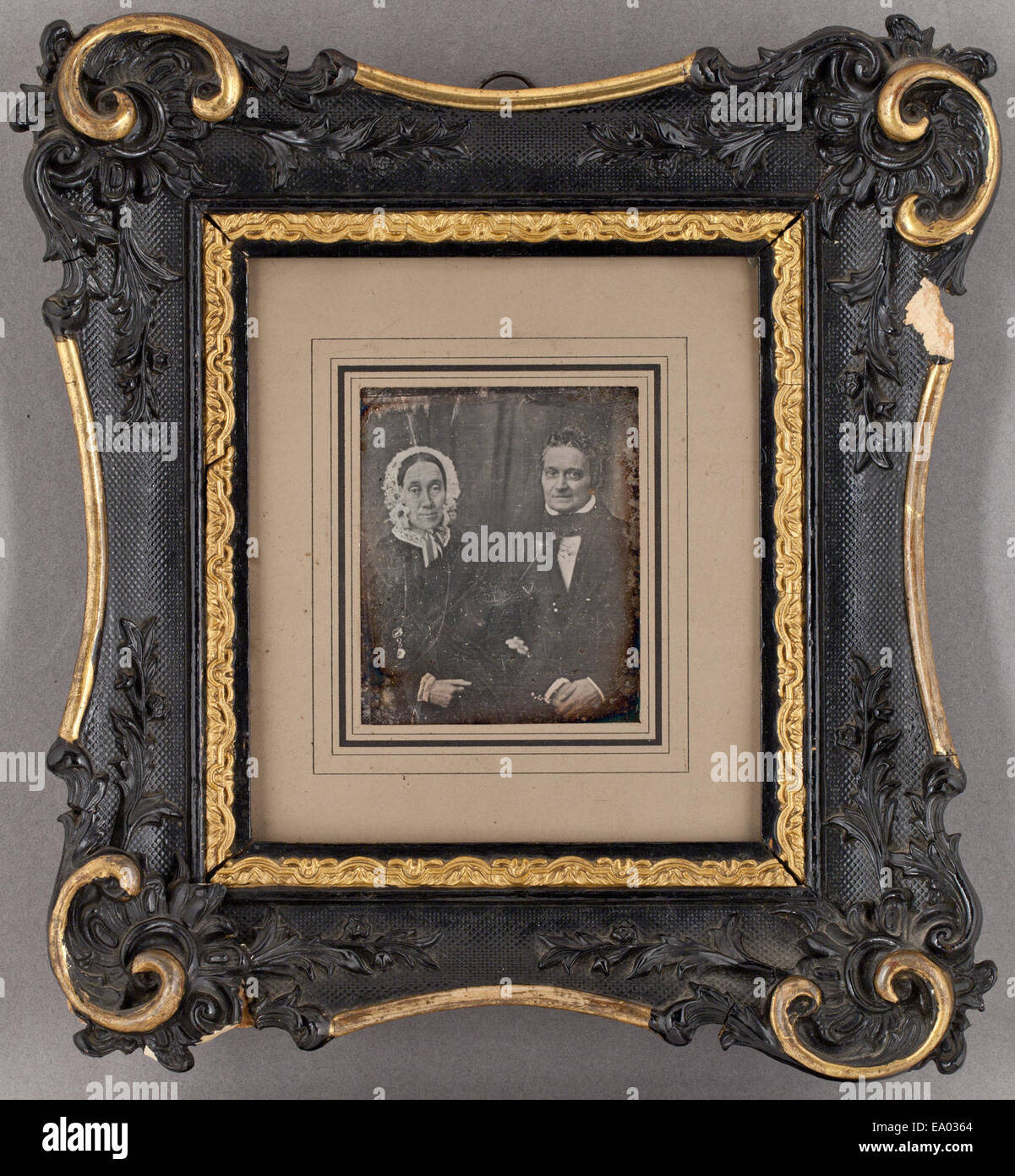 This daguerreotype portrait captures a couple in a historical ...