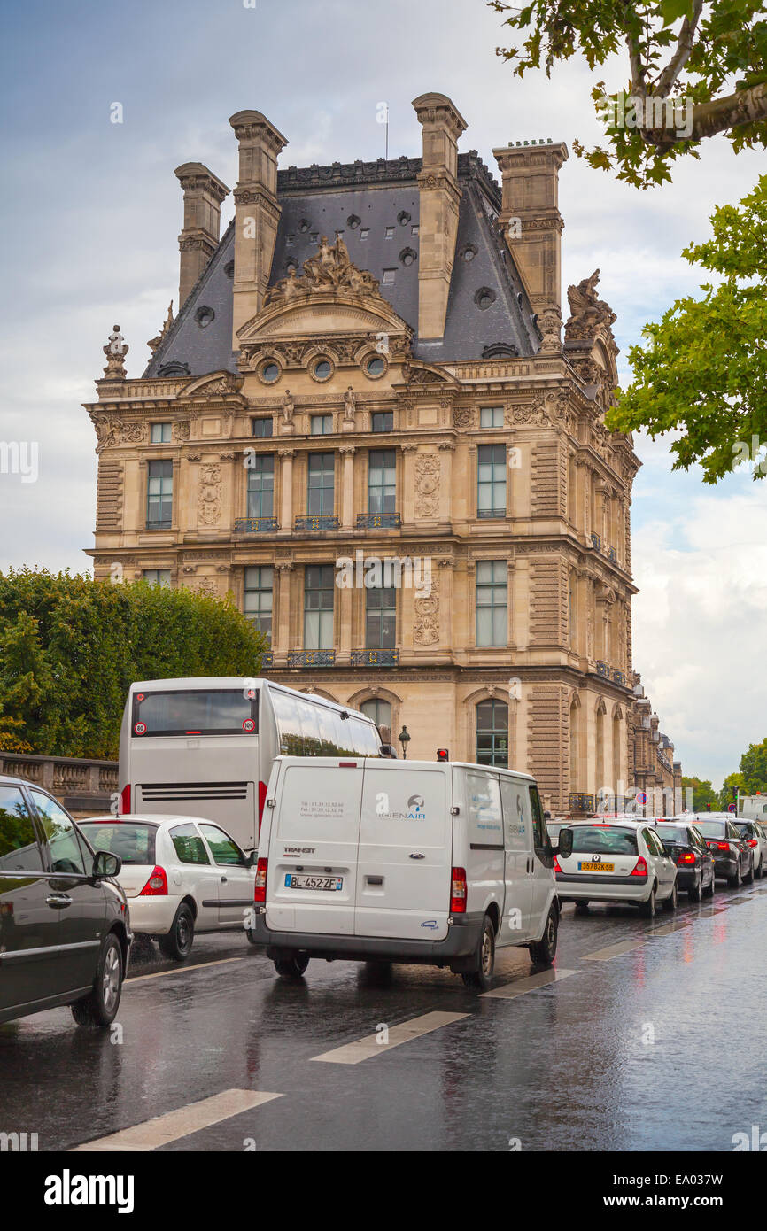 Paris, France - August 07, 2014: Rainy day, French cars go past the ...