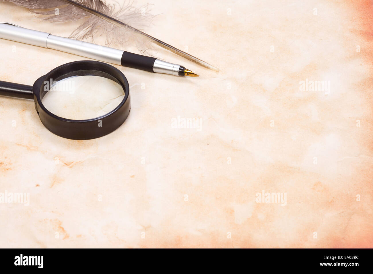 magnifying glass and pen at background Stock Photo - Alamy
