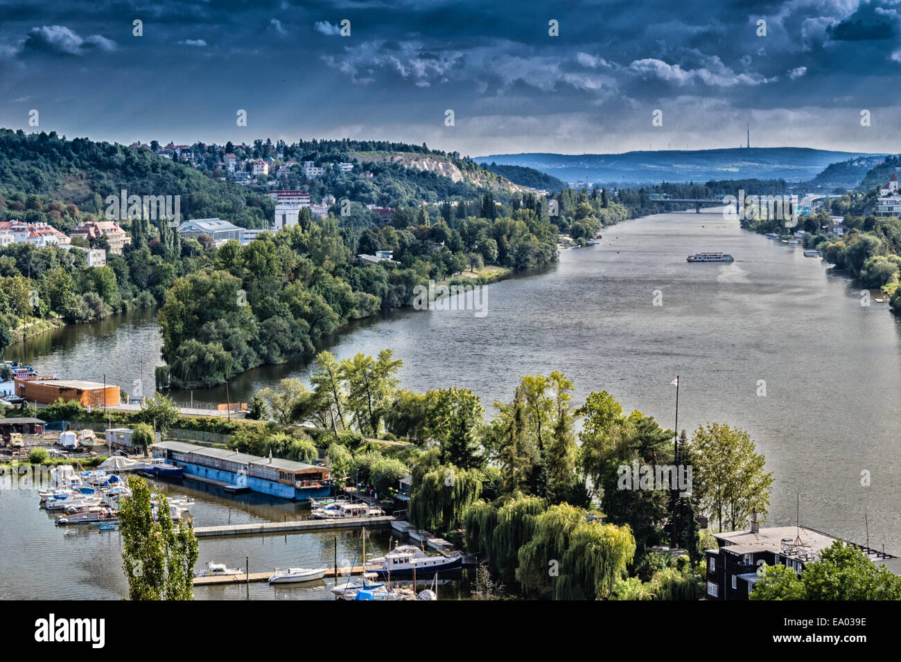 View of Prague from the Vltava river: house, trees, buildings and ...