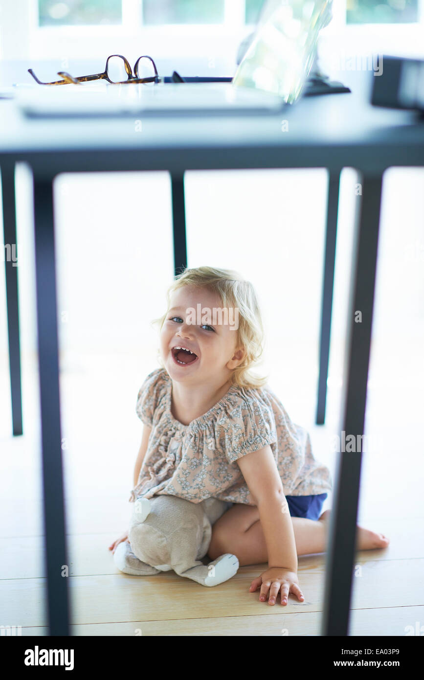Child hiding under table hi-res stock photography and images - Alamy