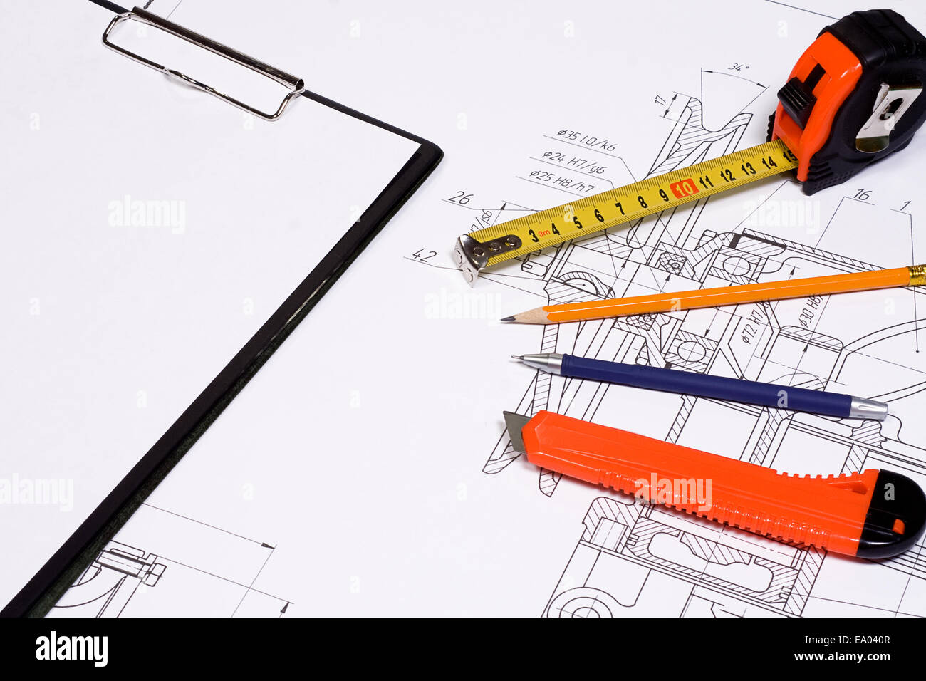 office knife, pen and tape measure at form Stock Photo - Alamy