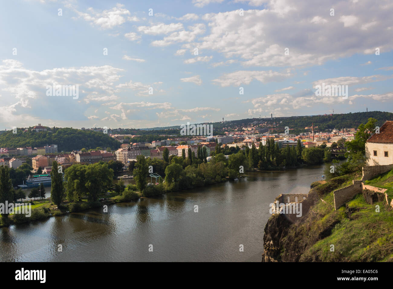 View of Prague from the Vltava river: house, trees, buildings and ...