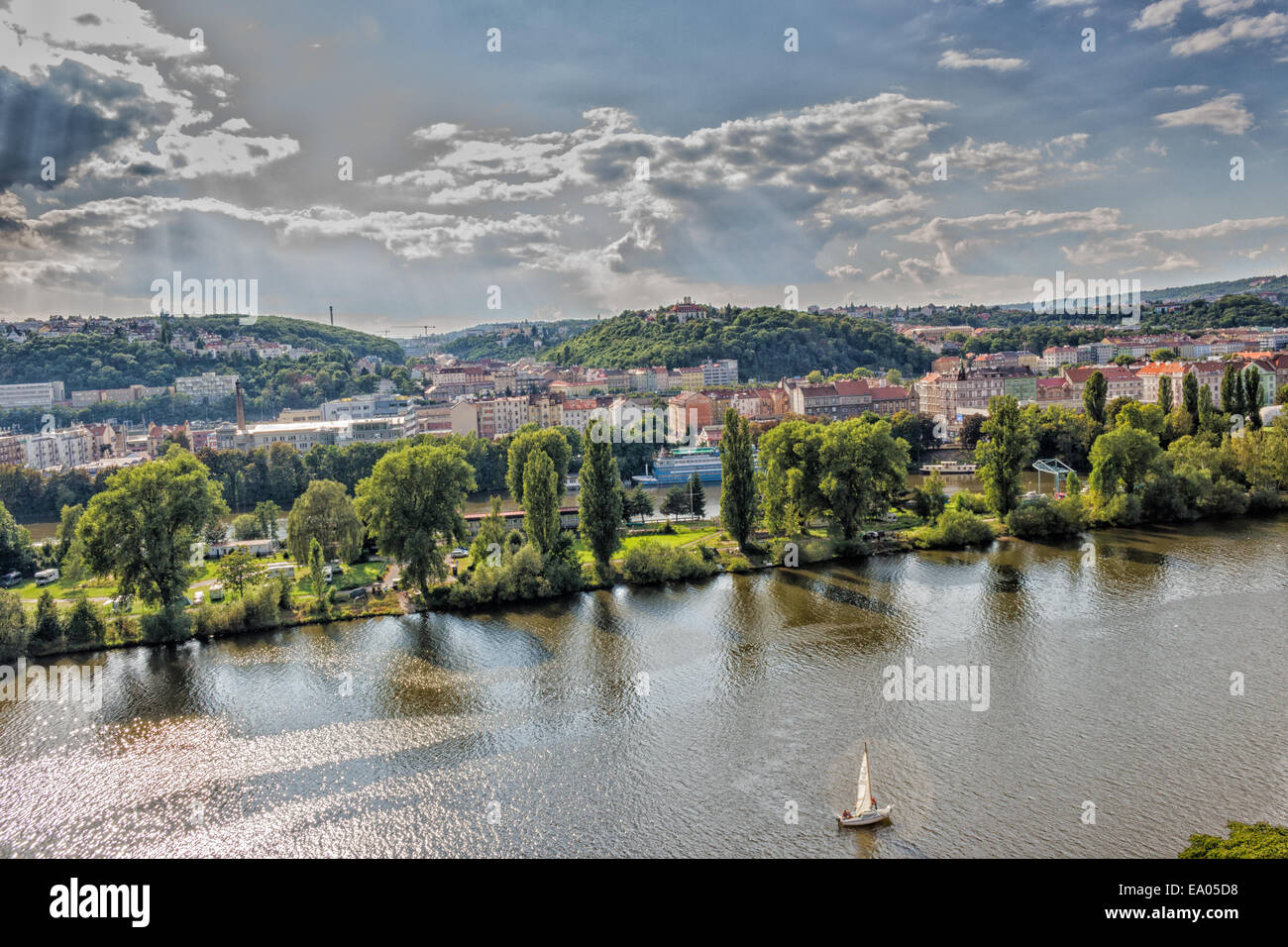 View of Prague from the Vltava river: house, trees, buildings and ...