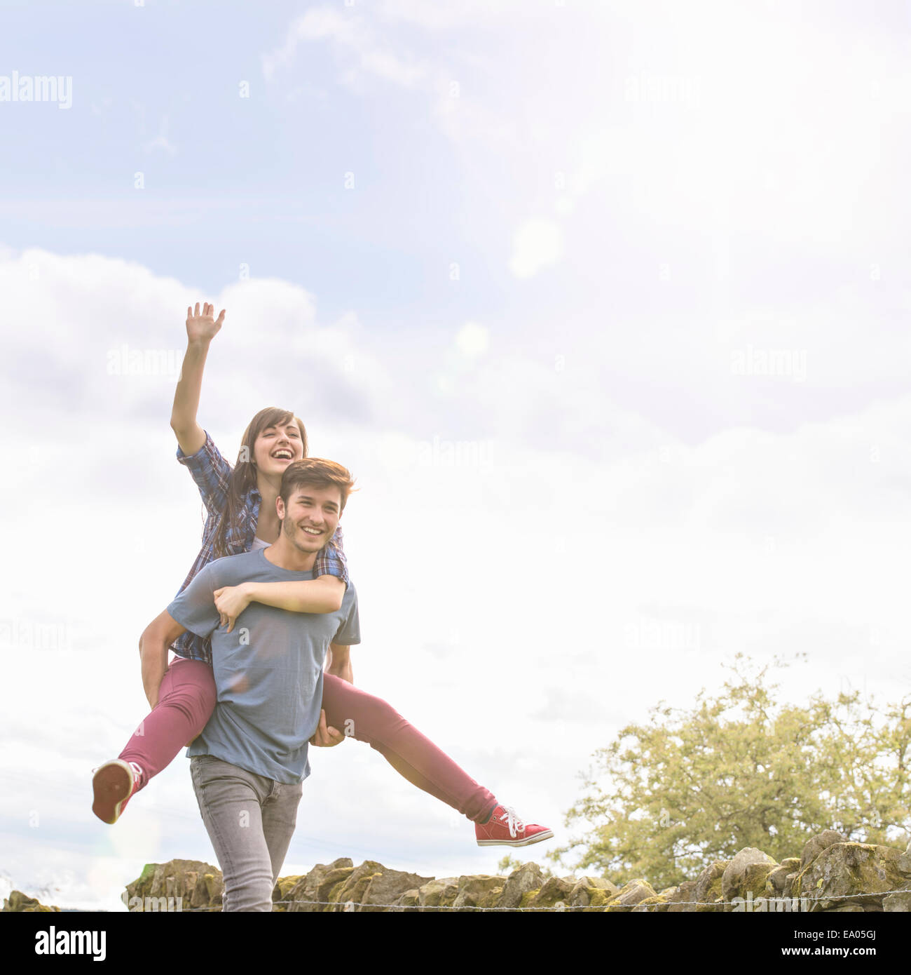 Young man giving girlfriend piggyback ride hi-res stock photography and ...
