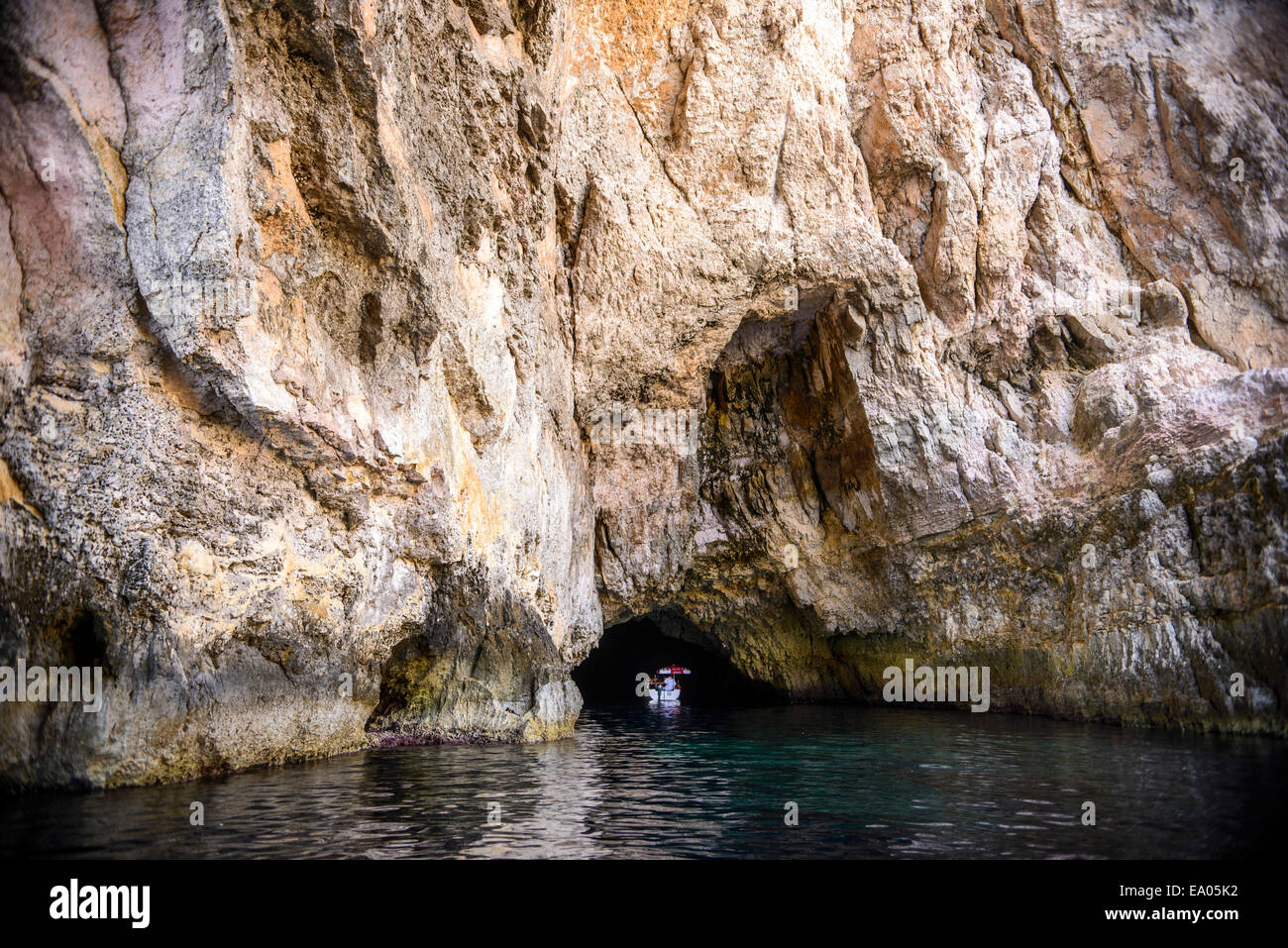 Tourist boat in the Blue Grotto sea caves in Malta Stock Photo - Alamy