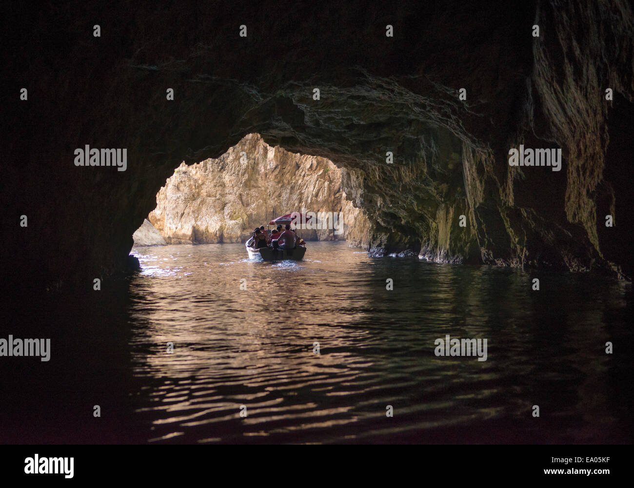 Tourist boat in the Blue Grotto sea caves in Malta Stock Photo - Alamy