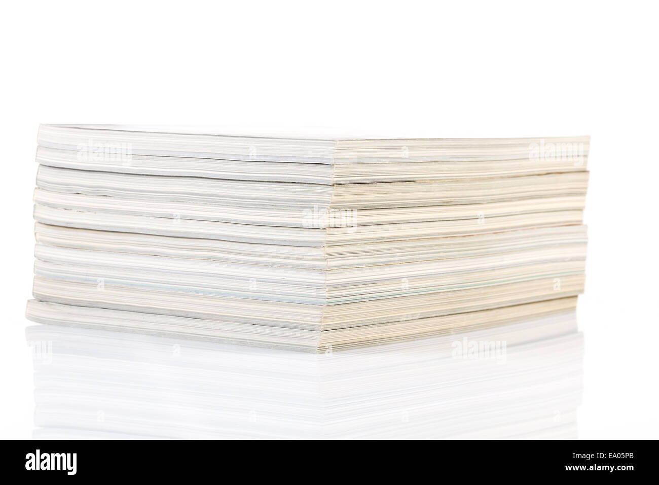 A stack of magazines isolated on a white background Stock Photo - Alamy